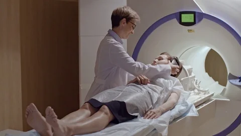 Radiologist Moving Patient into MRI Mach... | Stock Video | Pond5