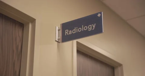 Radiology sign in a corridor of a hospit... | Stock Video | Pond5
