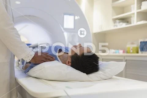 Radiology technologist preparing patient for MRI scan ~ Premium Photo ...