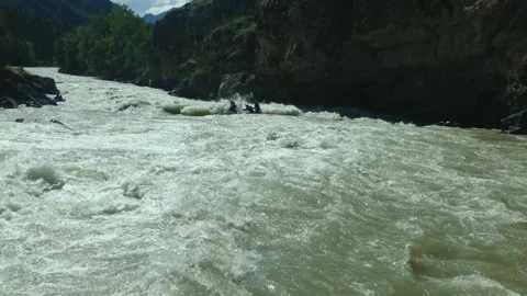 The rafting team descends the rough rapi... | Stock Video | Pond5