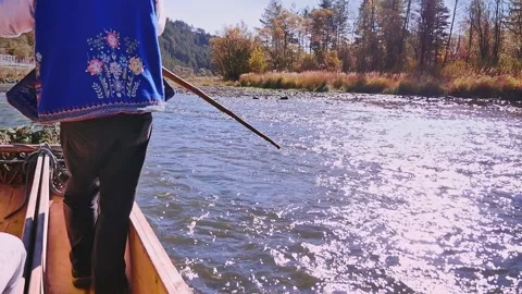 Raftsman rowing a raft along beautiful D... | Stock Video | Pond5