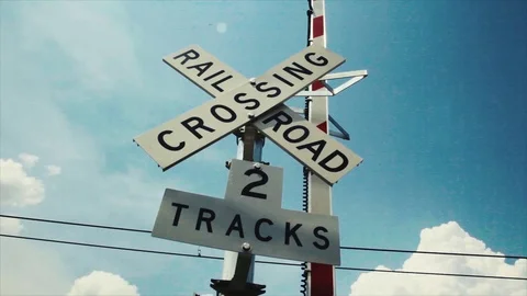 Railroad crossing with 2 tracks sign nea... | Stock Video | Pond5