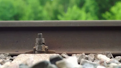 Railroad rail with fixing screw close-up... | Stock Video | Pond5