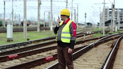 Railwayman with portable radio transmitt... | Stock Video | Pond5