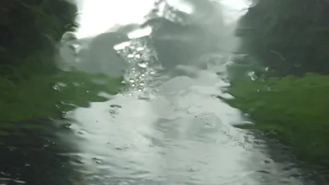Rain droplets down-pouring, falling and ... | Stock Video | Pond5