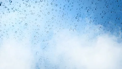 Rain drops on blue glass window with mot... | Stock Video | Pond5
