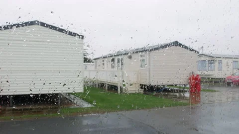 Rain falling on a caravan trailer vacati... | Stock Video | Pond5
