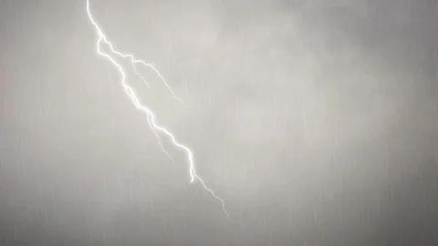 Rain falling in the cloudy sky with thun... | Stock Video | Pond5