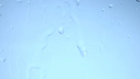 Rain falling on window. Bright blue back... | Stock Video | Pond5