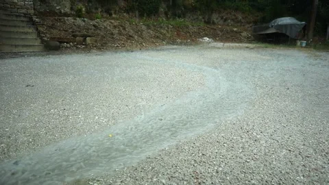 rain falls and flows into a hollow on th... | Stock Video | Pond5