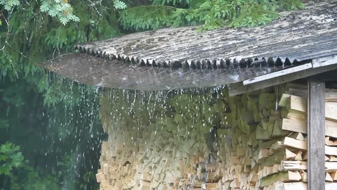 The rain is pouring hard outside the hou... | Stock Video | Pond5