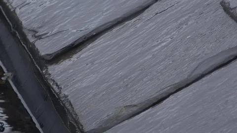 Rain running off slate roof into gutter ... | Stock Video | Pond5