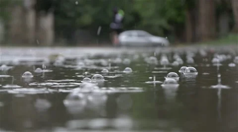 Rain slow motion, raindrops falling in t... | Stock Video | Pond5