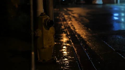 Rain storm drizzling a fire hydrant on a... | Stock Video | Pond5