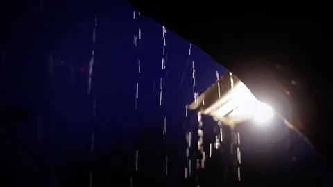 Rain Water dripping off of a Roof during... | Stock Video | Pond5