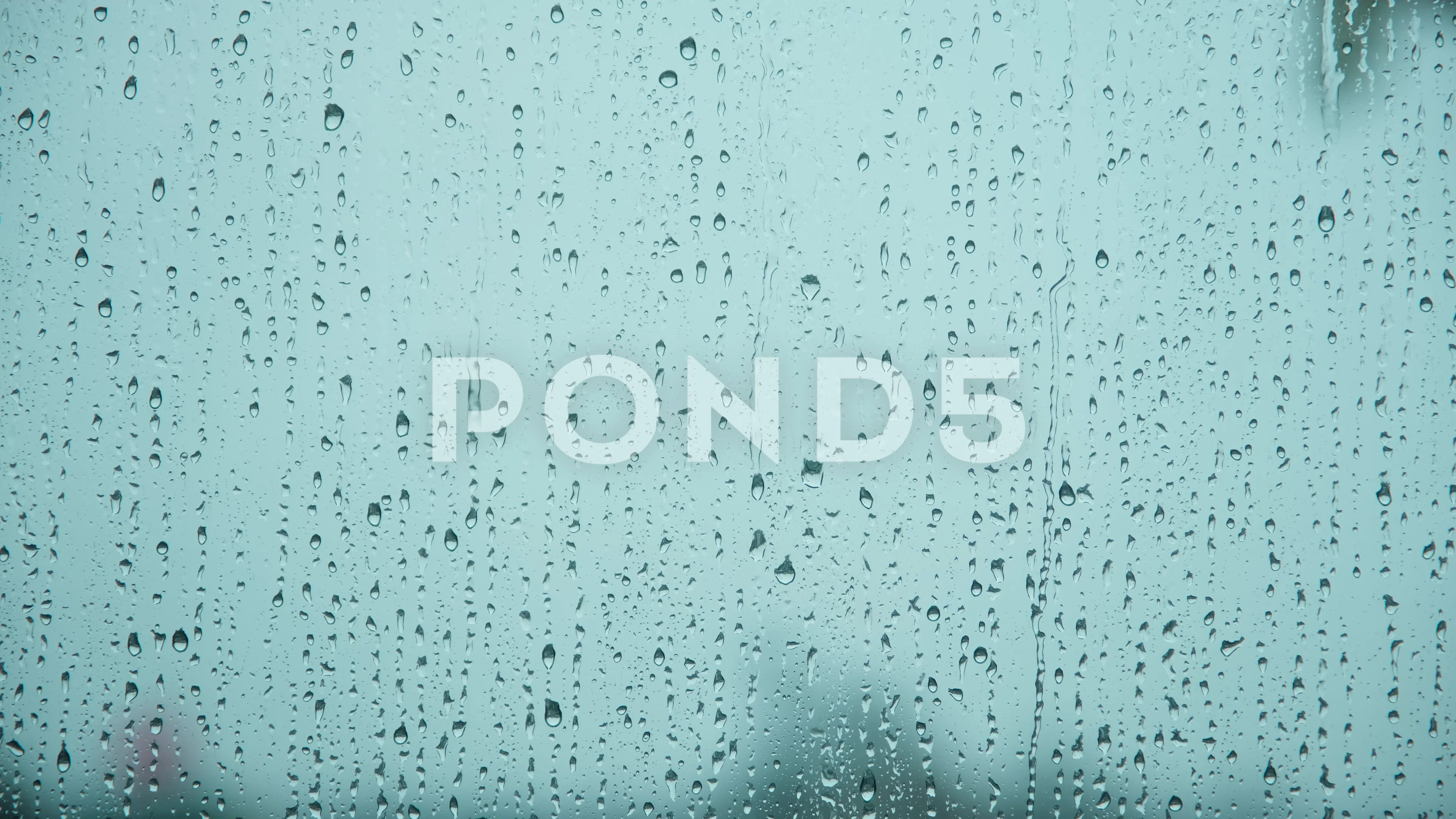 Rain Falling Down A Window Raindrops Trickling Down On Window Glass