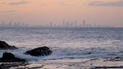 Rainbow Bay Beach, evening sky, Surfers ... | Stock Video | Pond5