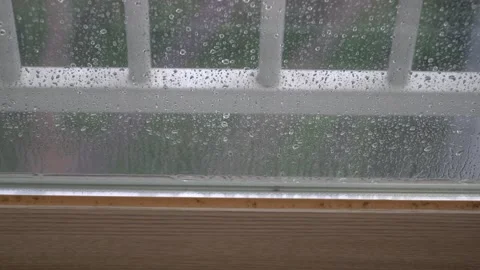 Raindrops Dripping On The Surface of Gla... | Stock Video | Pond5