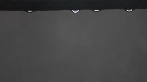 Raindrops falling down of a balcony rail... | Stock Video | Pond5