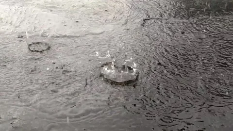 Raindrops falling down onto submerged co... | Stock Video | Pond5