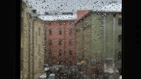 Raindrops sliding on window glass blurri... | Stock Video | Pond5