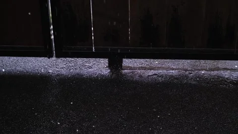 raining in the background of the gate | Stock Video | Pond5