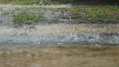 Raining on the ground water splash. | Stock Video | Pond5