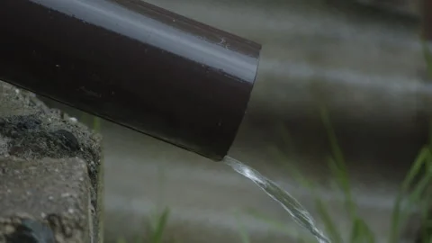 Rainwater flow through gutter downspout ... | Stock Video | Pond5