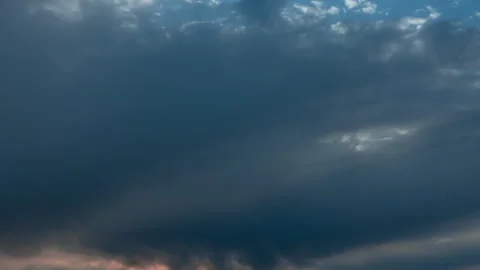 Rainy gray sky with clouds illuminated b... | Stock Video | Pond5