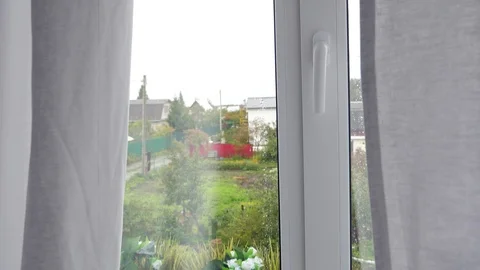 Rainy weather through window with curtai... | Stock Video | Pond5
