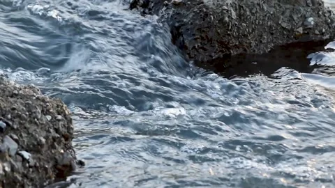 Rapid water flow between two concrete bo... | Stock Video | Pond5