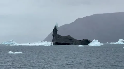 Rarely seen black iceberg with a strange... | Stock Video | Pond5