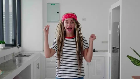 a rasta girl with dreadlocks and a brigh... | Stock Video | Pond5