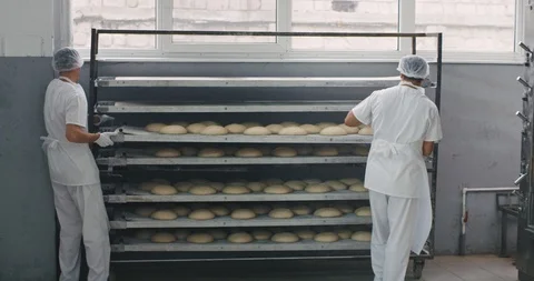Raw bread load from the shelf in the ind... | Stock Video | Pond5