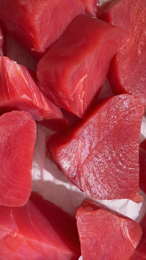 Raw tuna chunks displayed closely showin... | Stock Video | Pond5
