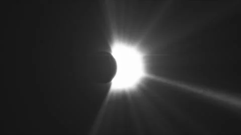 Rays of sun-light, moon covering the sun... | Stock Video | Pond5