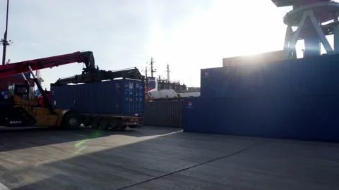 Reachstacker removes container from truc... | Stock Video | Pond5
