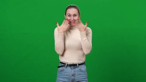 Reaction of excited young woman on green... | Stock Video | Pond5