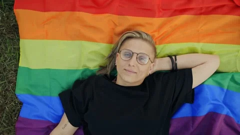 Real LGBT lesbian woman smiles lying on ... | Stock Video | Pond5
