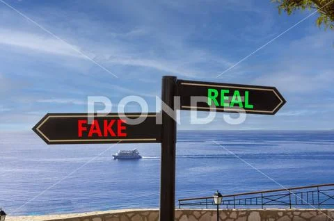 Real or fake symbol. Concept word Real or Fake on beautiful signpost ...