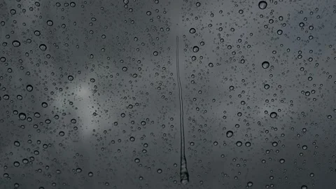 real rain drops sliding on window glass ... | Stock Video | Pond5