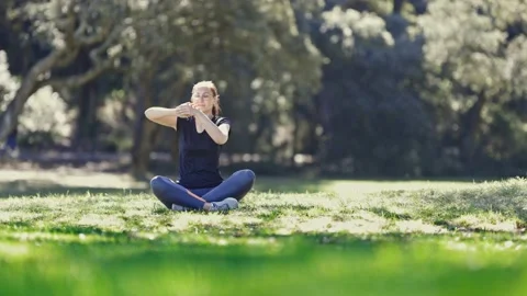 Real woman sit in lotus position and str... | Stock Video | Pond5