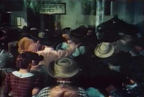 Rear view of angry crowd storming sherif... | Stock Video | Pond5