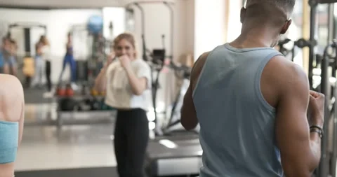 Rear view of a coach teaching boxing in ... | Stock Video | Pond5