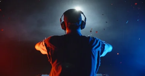 Rear view of cool dj performing in a nig... | Stock Video | Pond5