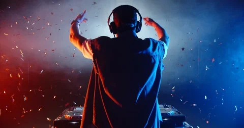Rear view of cool dj performing in a nig... | Stock Video | Pond5