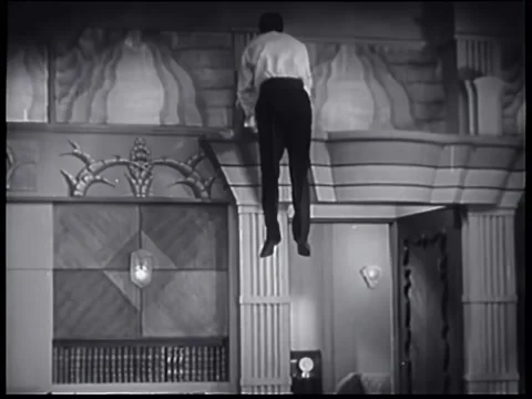 Rear view of excited man jumping on wall | Stock Video | Pond5