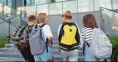Rear view. Good-looking school child fri... | Stock Video | Pond5