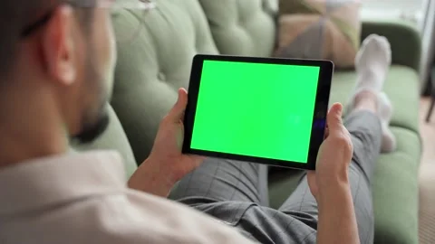 Rear view on green screen over shoulder ... | Stock Video | Pond5