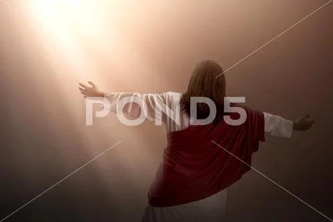 Rear view of Jesus Christ with open palm standing Stock Image #166502881